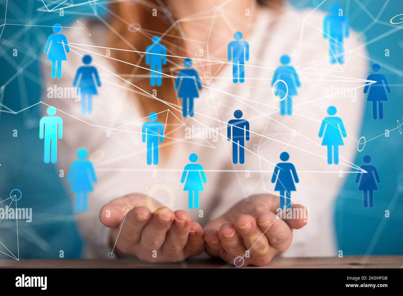 A group of 3D rendered people icons hovering over woman's hands Stock ...