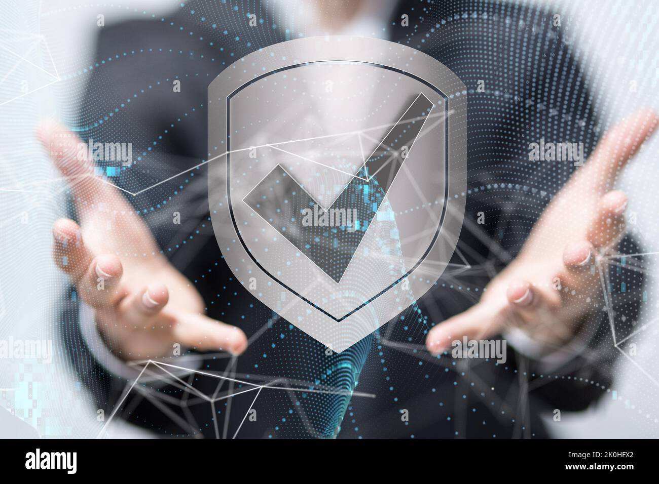A digital shield icon between two hands - cybersecurity of network ...