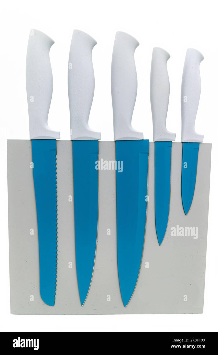 A set of blue knives on a stand isolated on a white background Stock ...