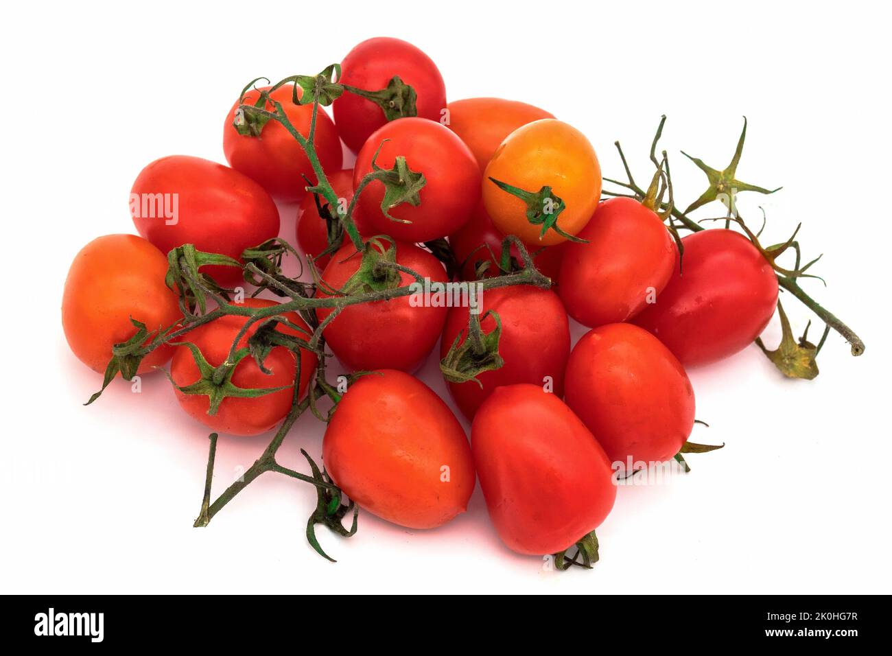 A closeup shot of large cherry tomatoes isolated on a white background ...