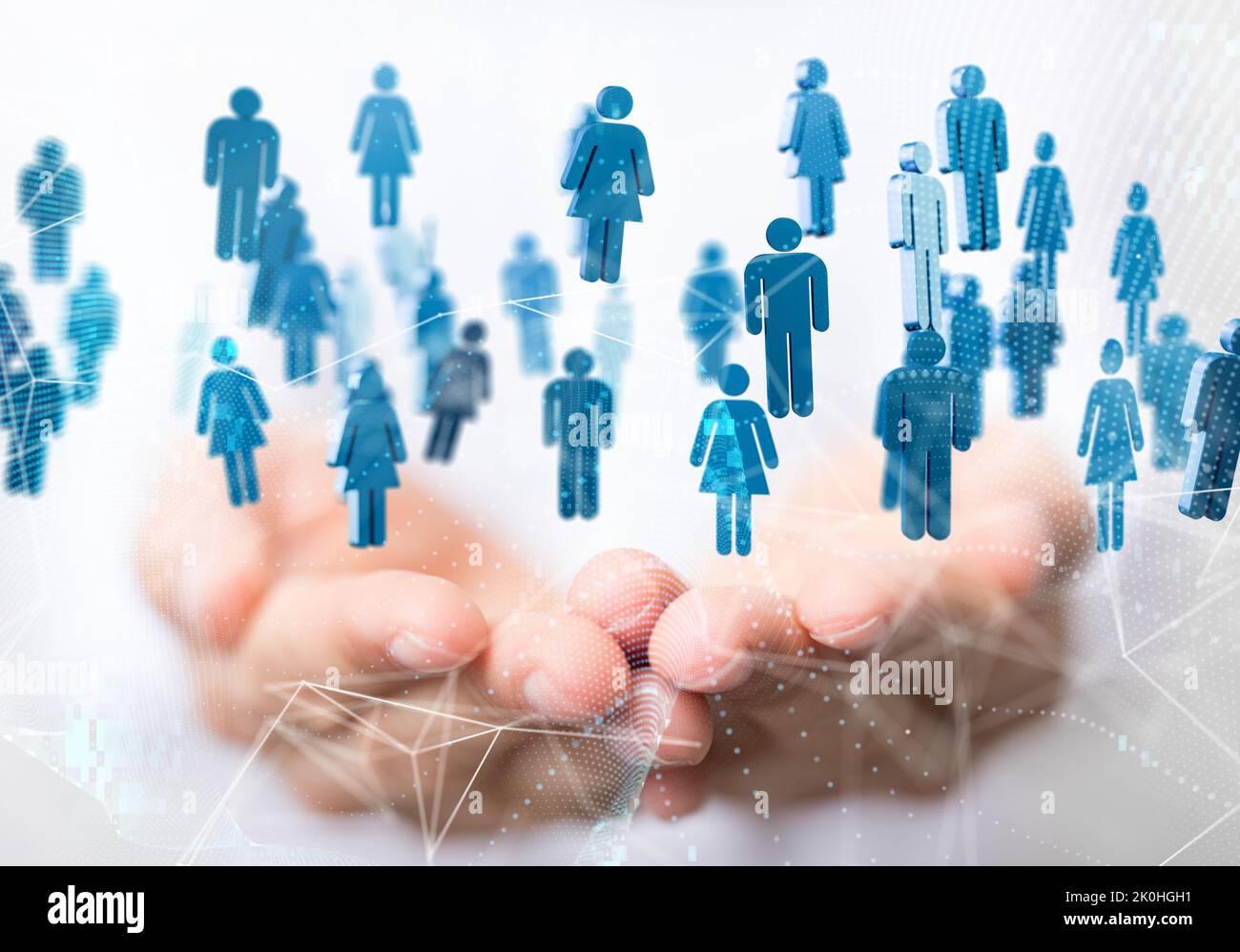 A group of illustrated people icons floating above hands Stock Photo ...