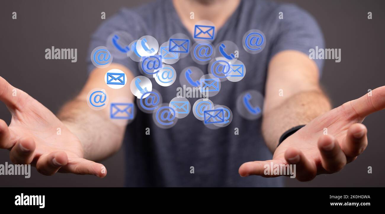 A closeup of hands holding 3D rendered communication icons as online ...