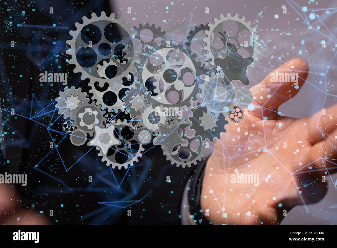 A hand holding a floating gear system data with connected lines and ...