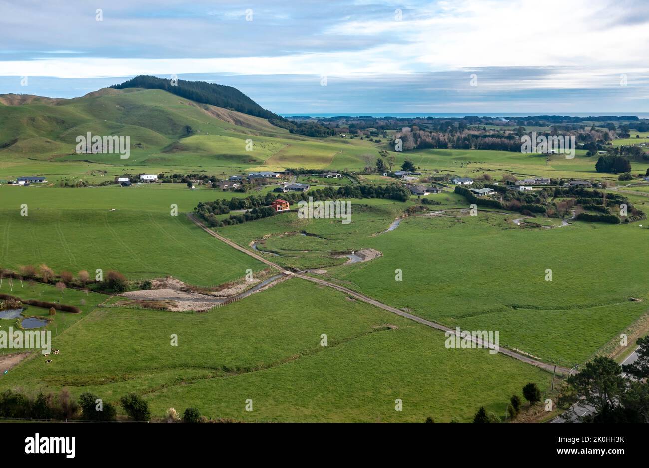 An aerial view of the countryside and the Tasman Sea in the background ...