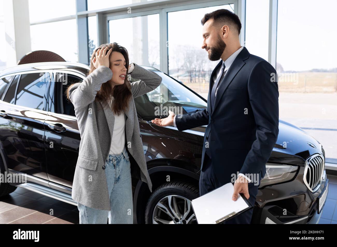 Angry customer at car dealership talking to car dealer, car insurance ...