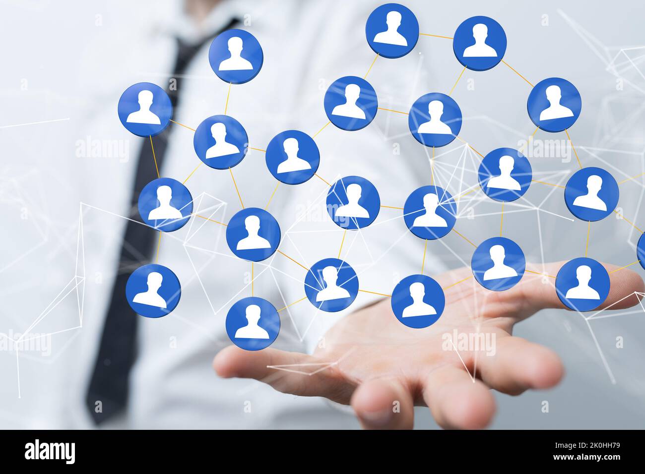 A businessman showing 3D rendered user icons in cyberspace floating on the palm of his hand ...