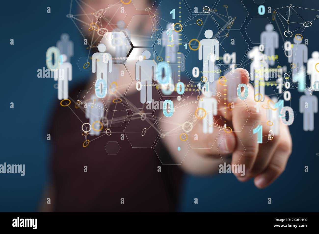 A finger pointing on 3d floating people icons and binary code- a ...