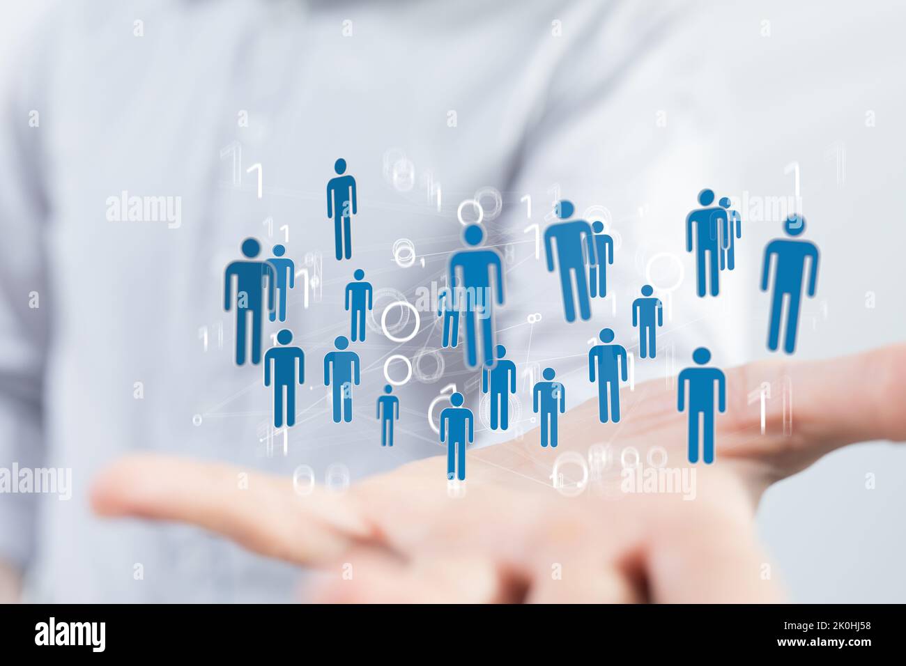 3d floating people icons and binary code over a hand - a concept of networking, HR ...