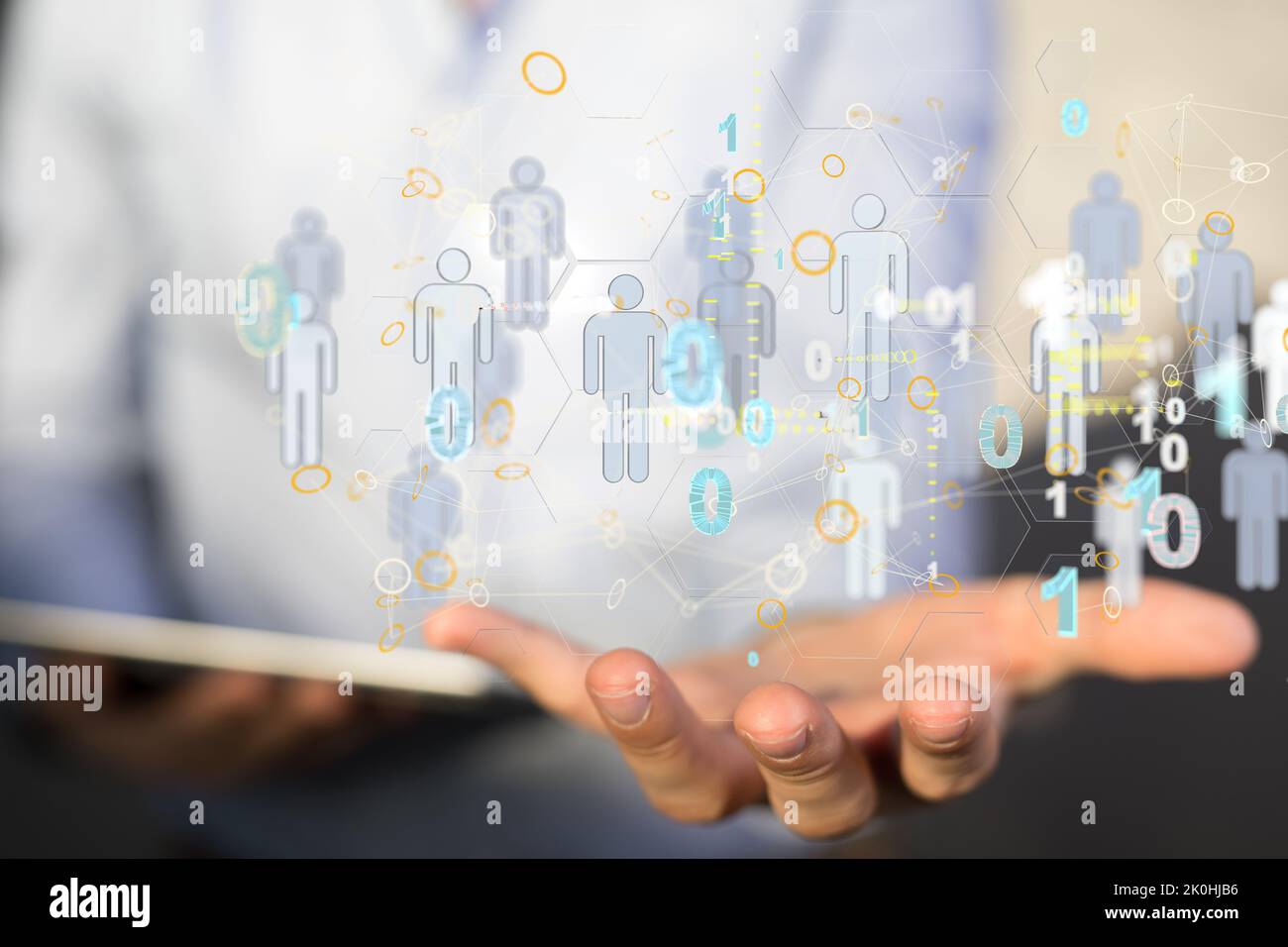 Some icons of people and data linked together above mans hand Stock ...