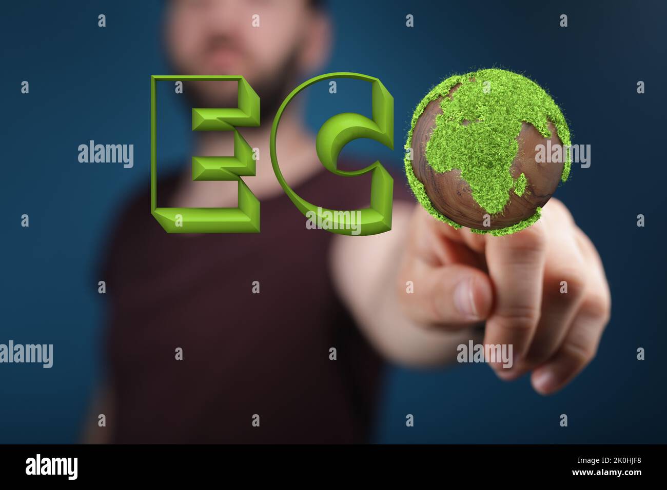 A male hand touching a 3D rendered ECO word made from grass and globe ...