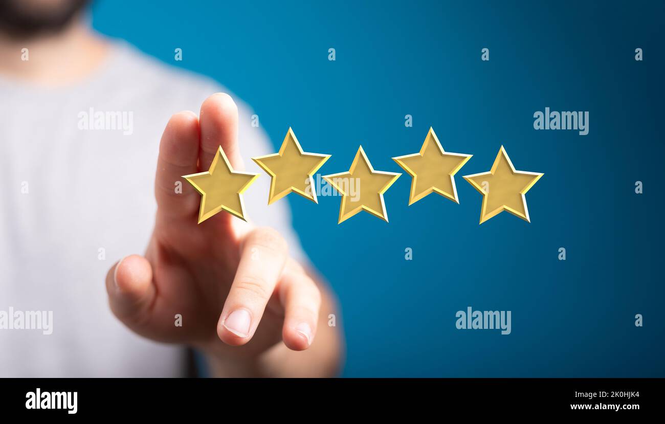 A man pointing to an illustrated five-star feedback with a blurry ...