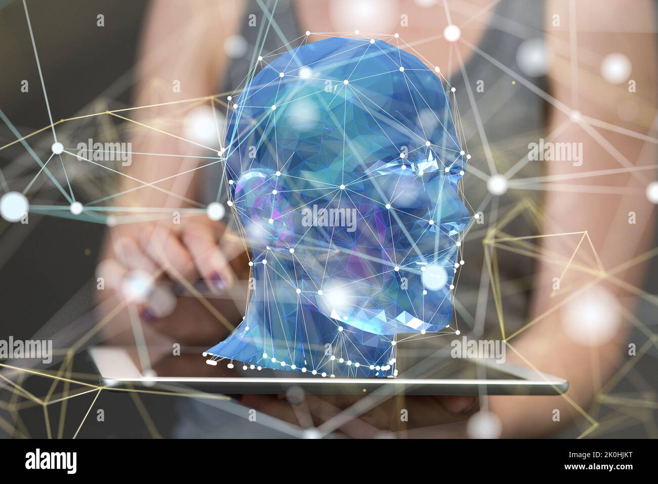 The human head over a tablet surface - artificial intelligence concept ...