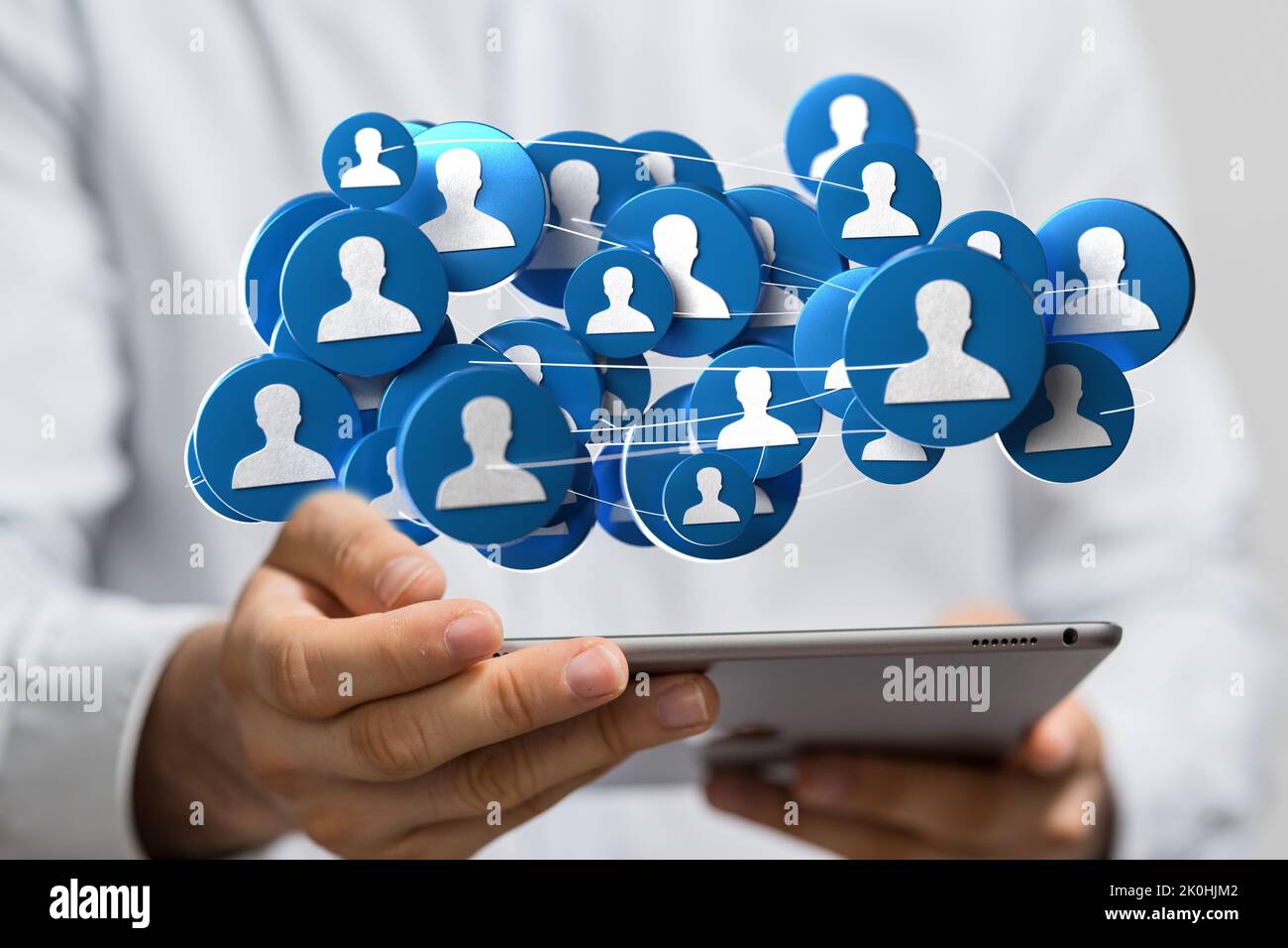 A closeup shot of a man holding a tablet with an illustrative ...