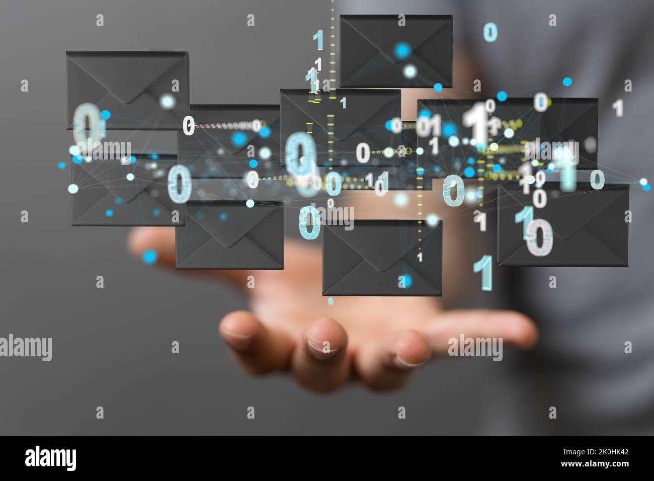 The hovering envelopes with binary numbers above the hand Stock Photo - Alamy