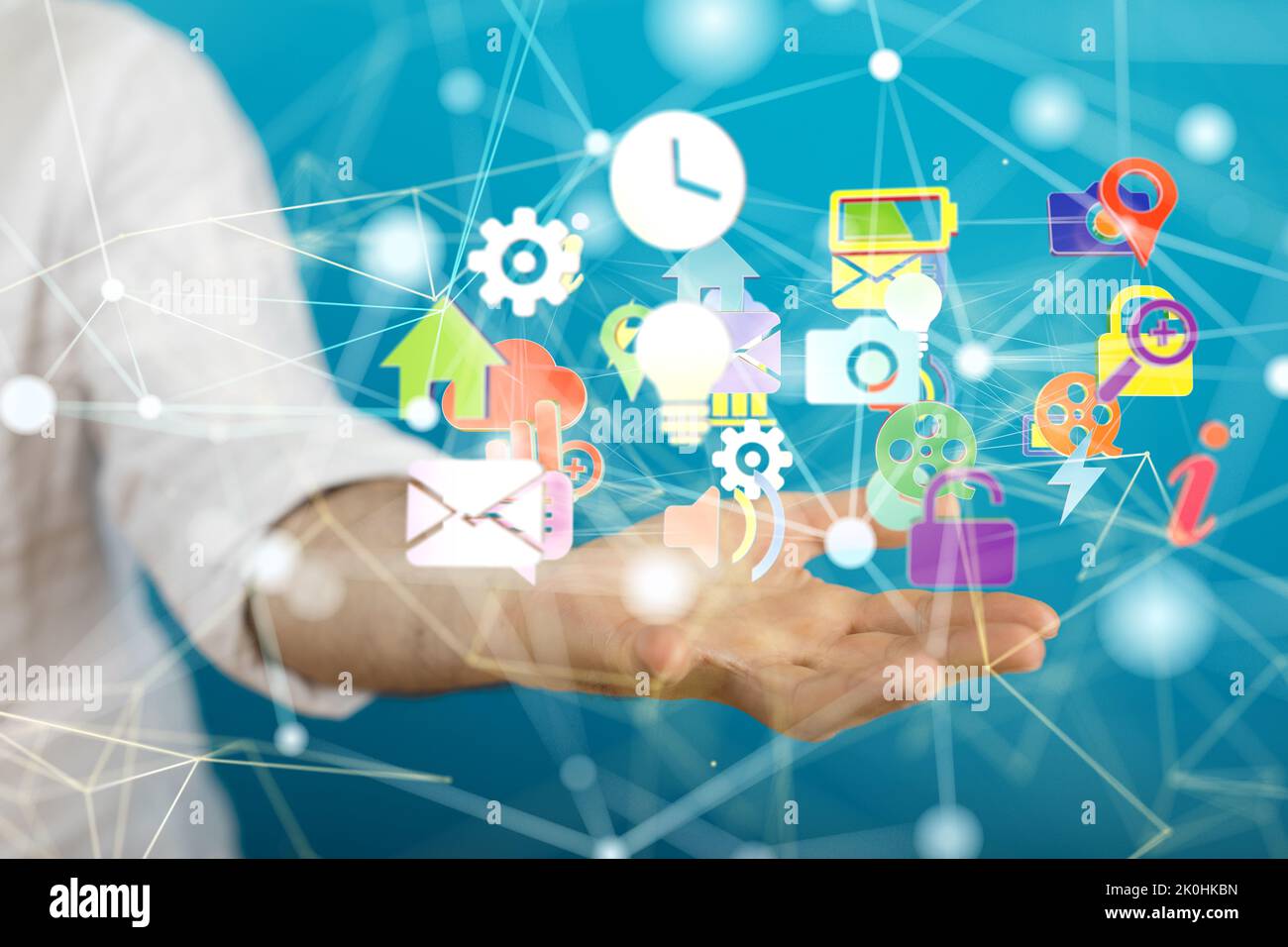 The hand presenting colorful digital symbols - electronic devise icons ...