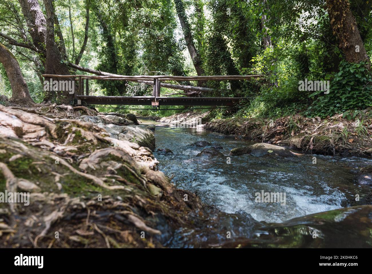 A beautiful view of a wooden bridge over Hueznar river Stock Photo - Alamy