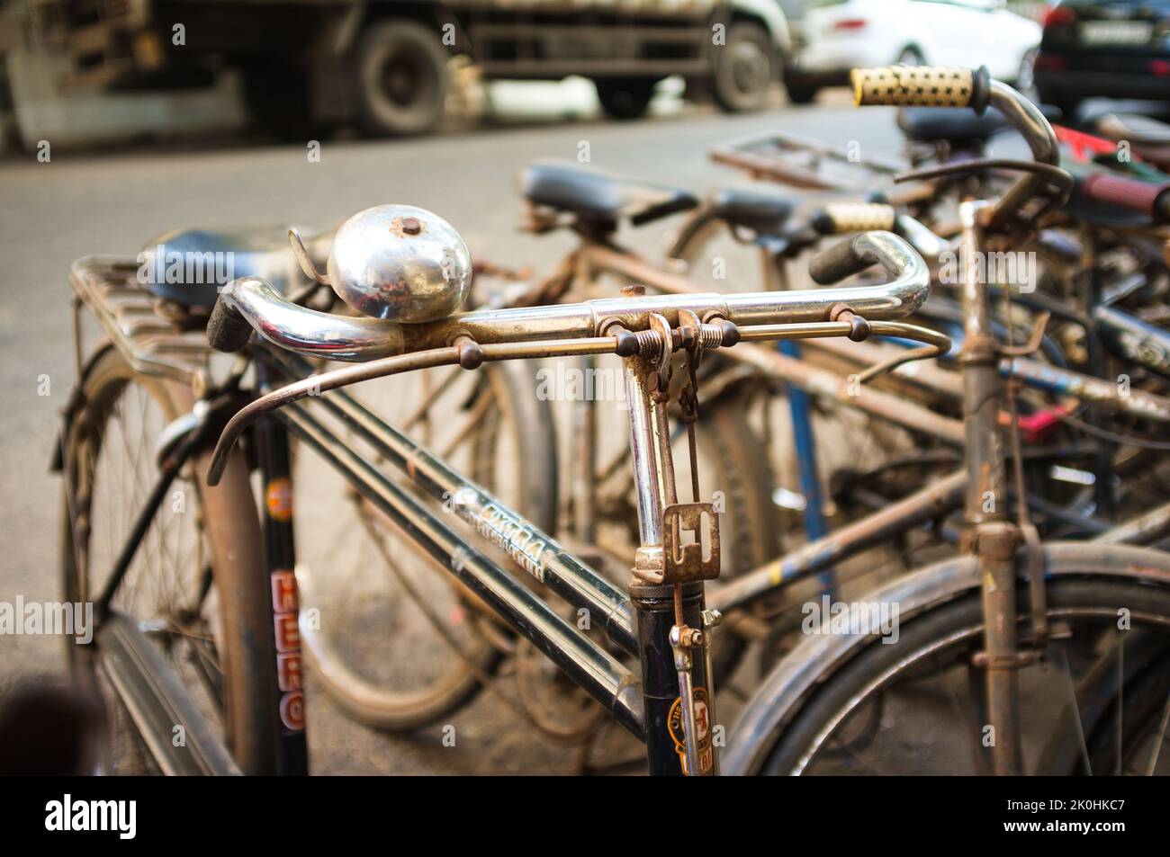 A closeup of a vintage rusty bicycle in the streets of Mumbai, India ...