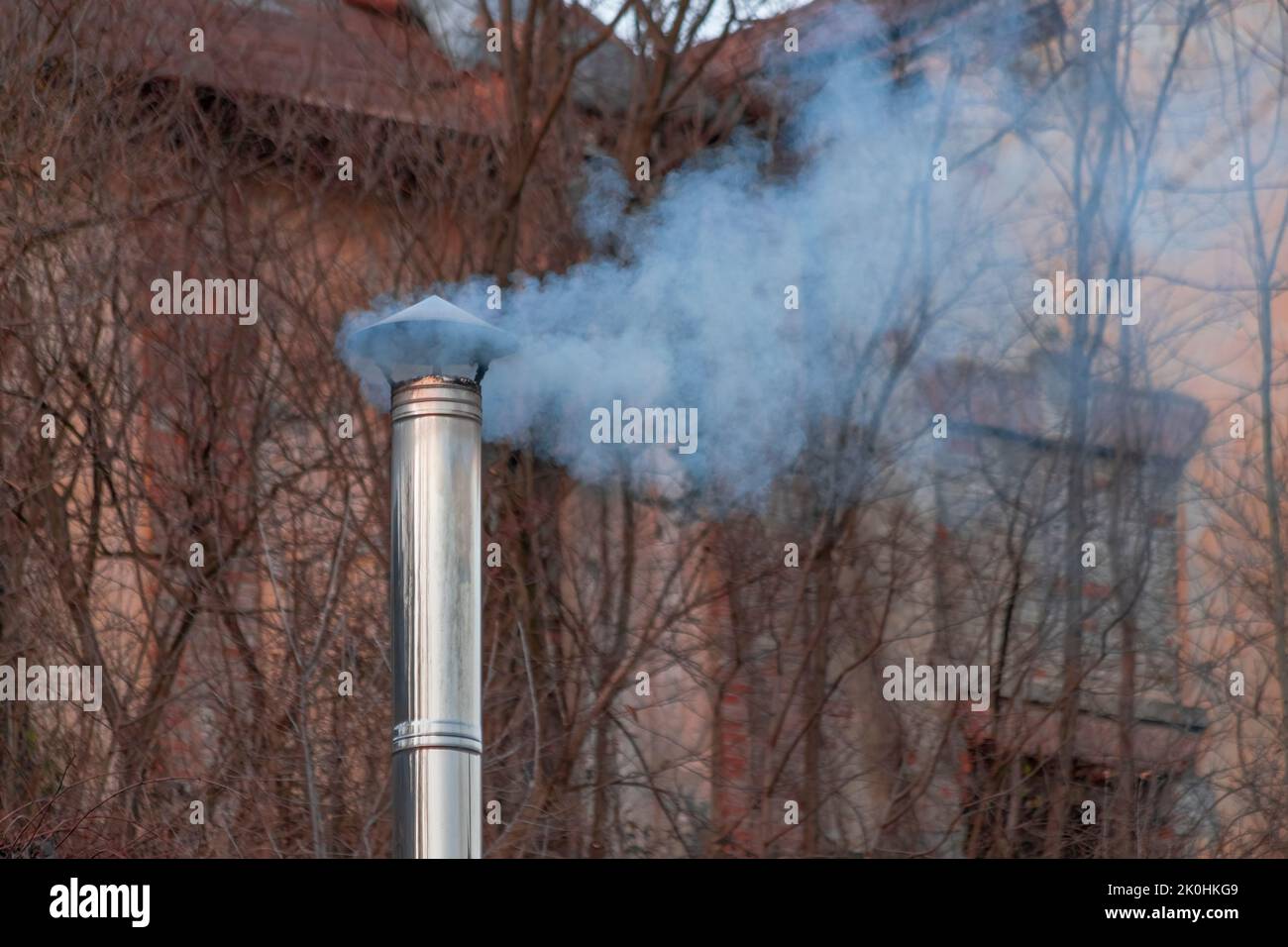 A view of smoke rising from a chimney Stock Photo - Alamy