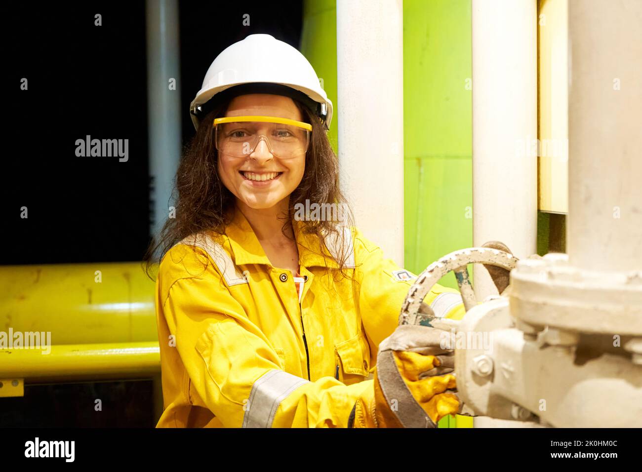 Installation showing the process of drilling an oil well. Woman in ...