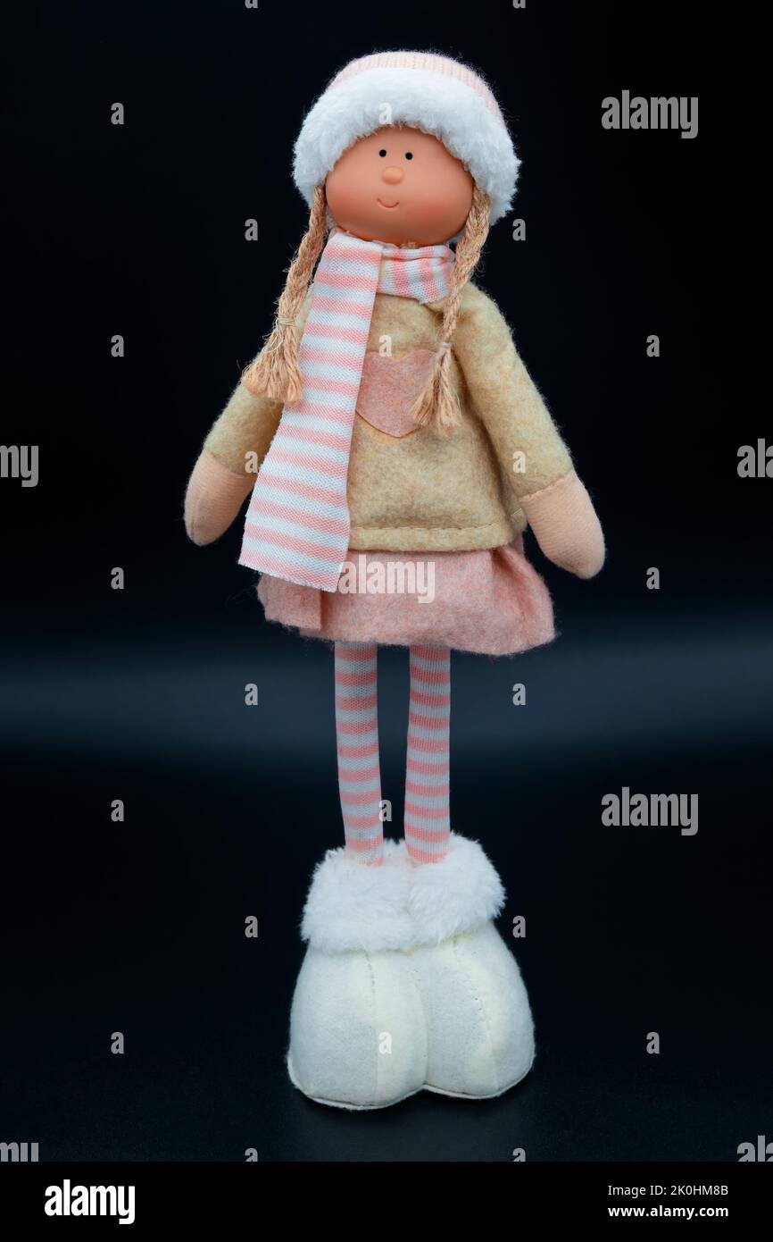 A vertical shot of a cute happy doll for Christmas design isolated on a ...