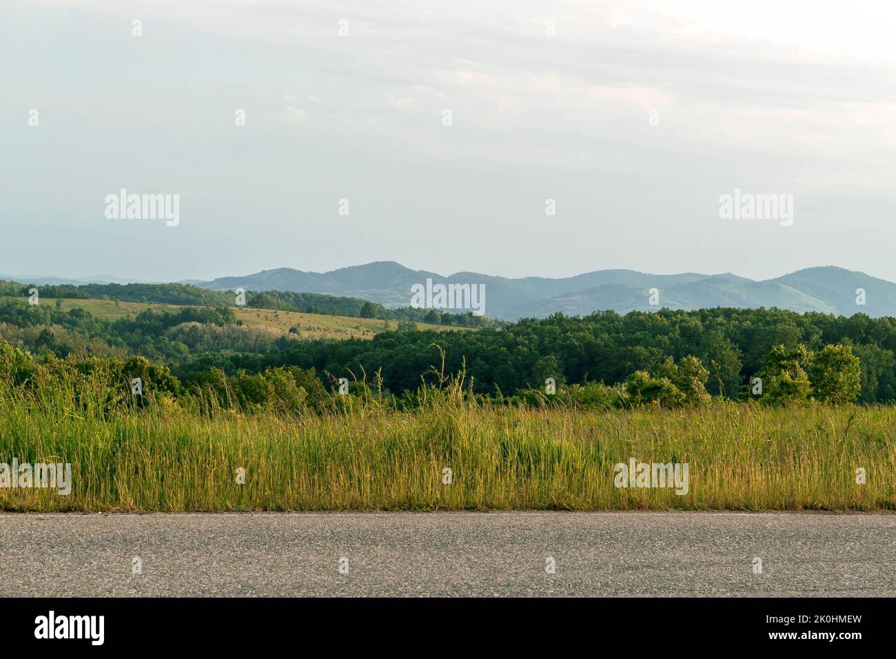 A landscape with hills and forests far from the road Stock Photo - Alamy