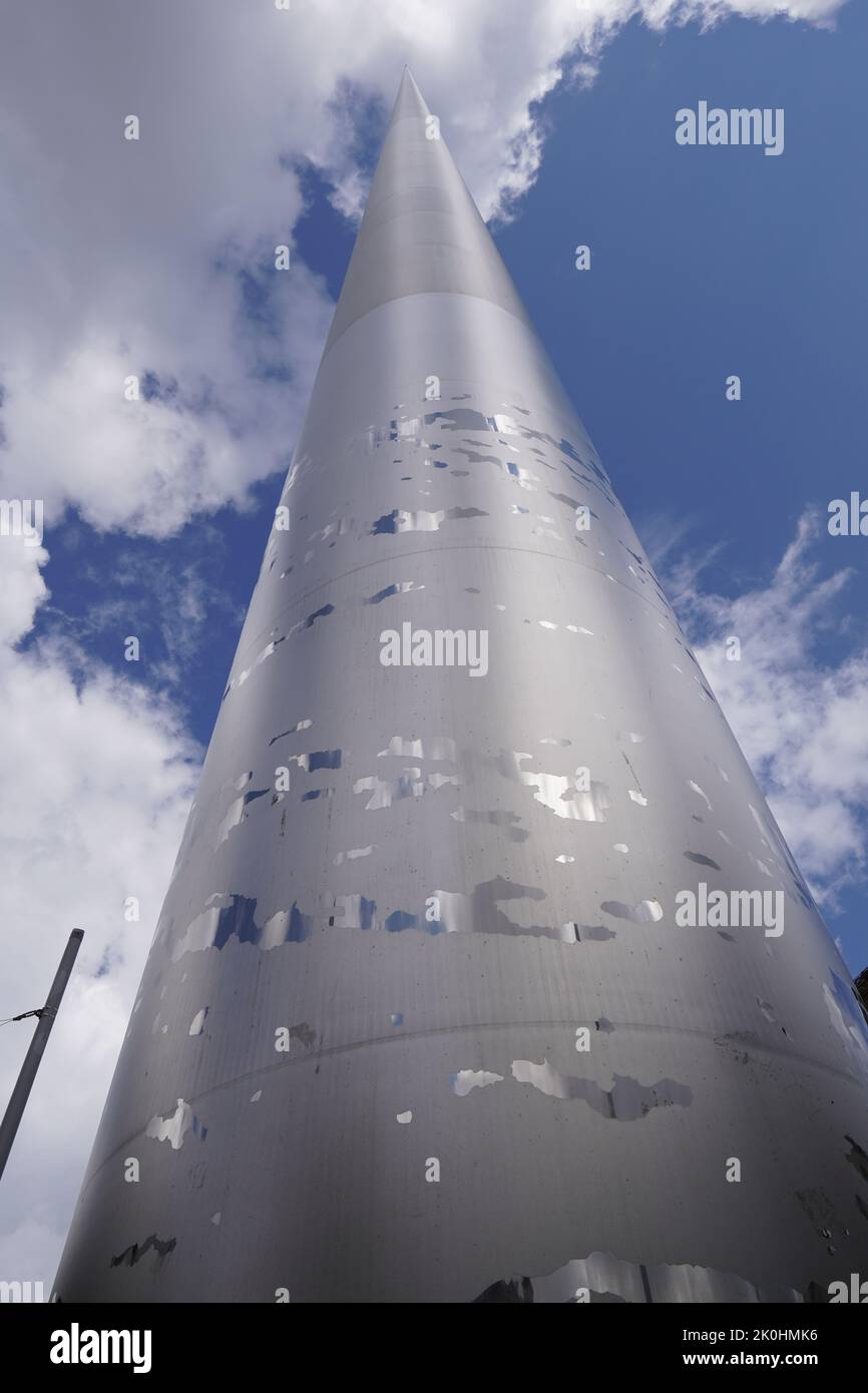 A long and tall steel bar with a cloudy sky background Stock Photo - Alamy