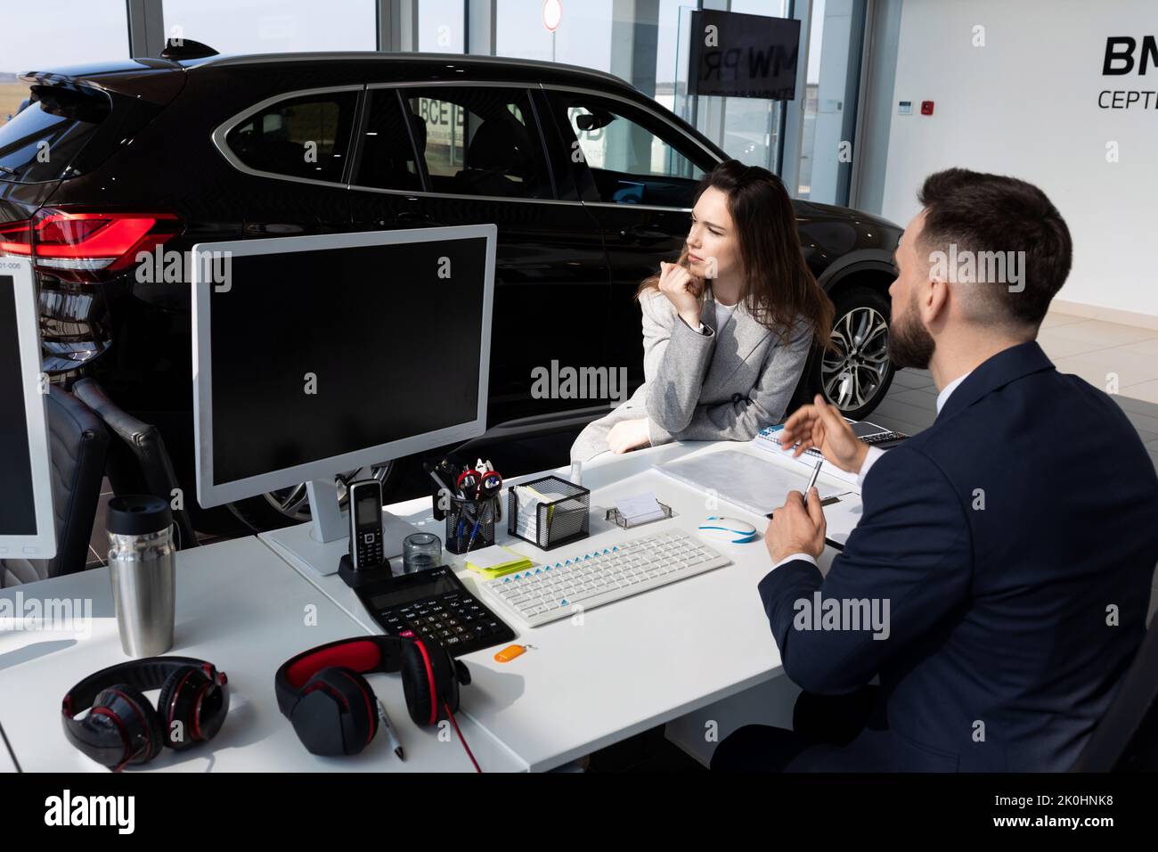 Car dealership manager advises hi-res stock photography and images - Alamy