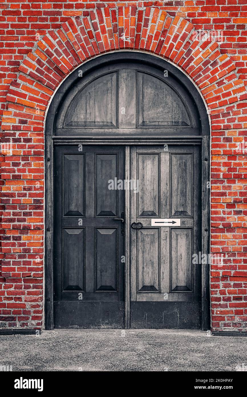 An entrance door of a brick building Stock Photo - Alamy