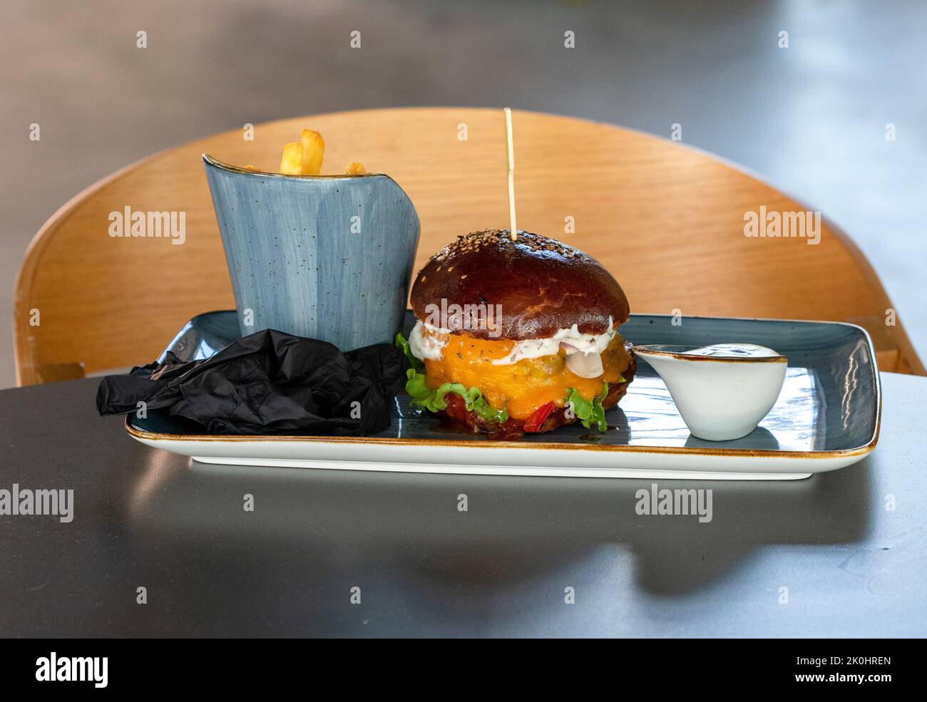 A fast food order of a cheeseburger and fries served on table Stock ...