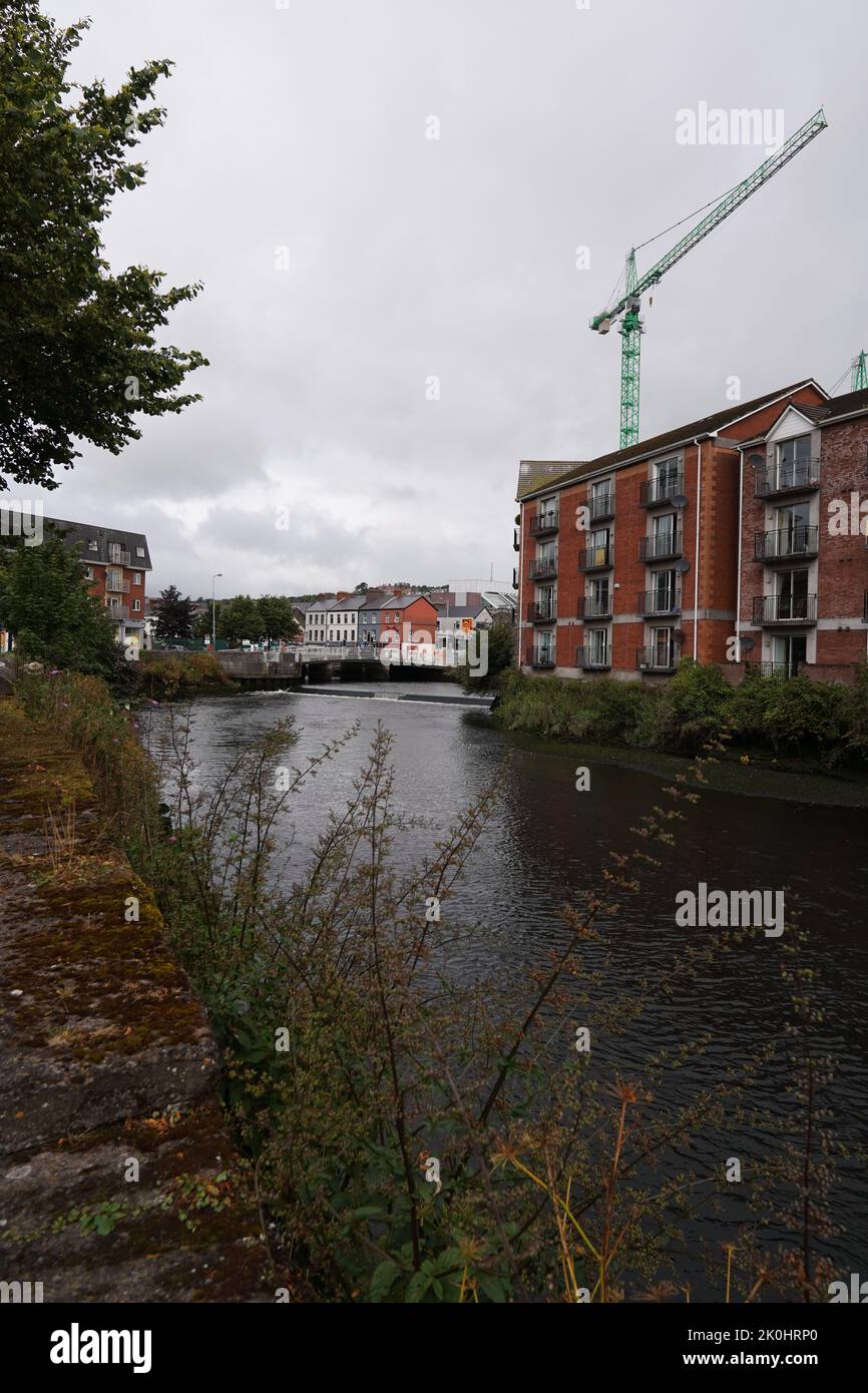 A vertical shot of riverside buildings under construction Stock Photo ...