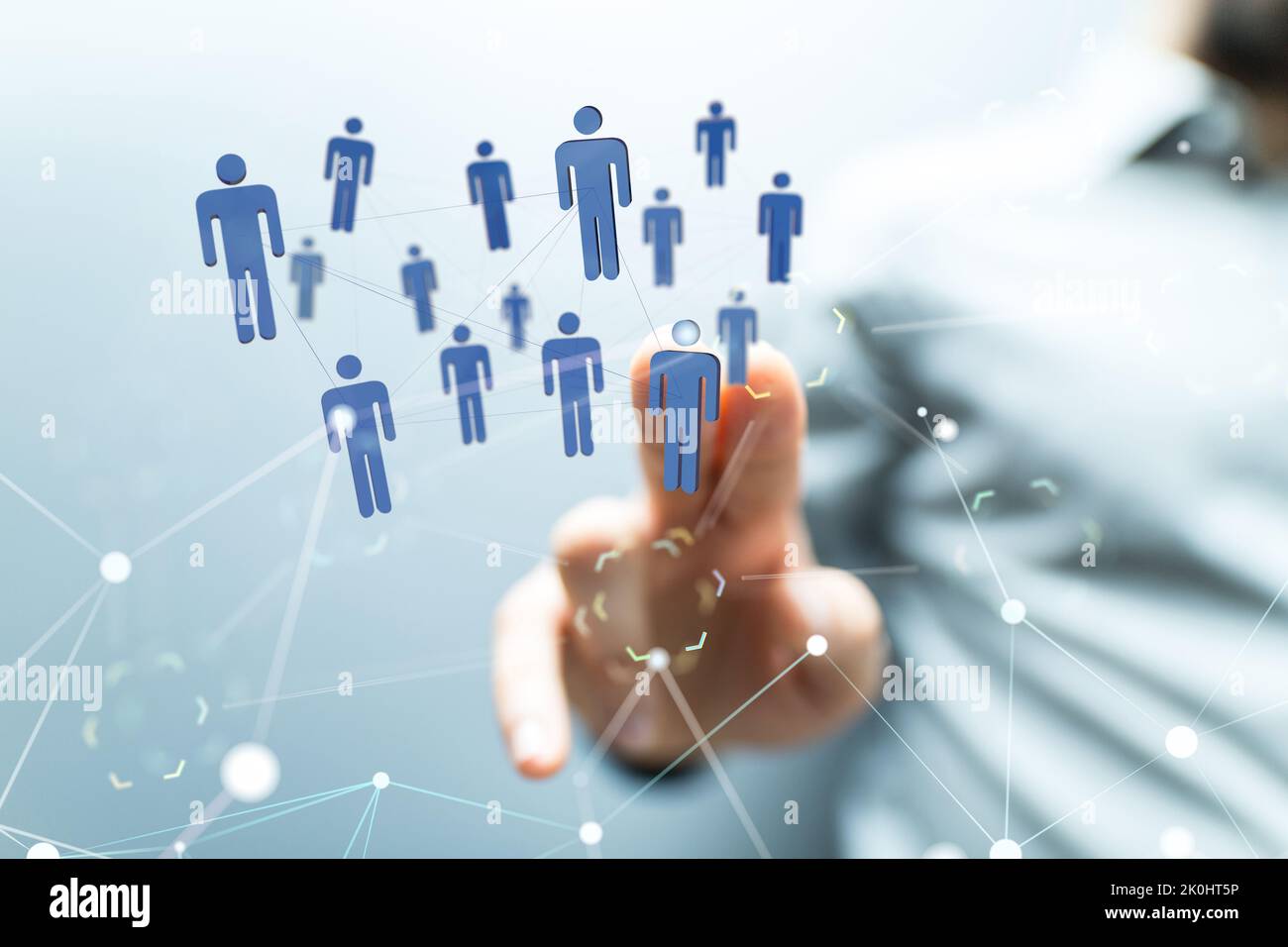A man reaching for the illustrated male icons Stock Photo - Alamy