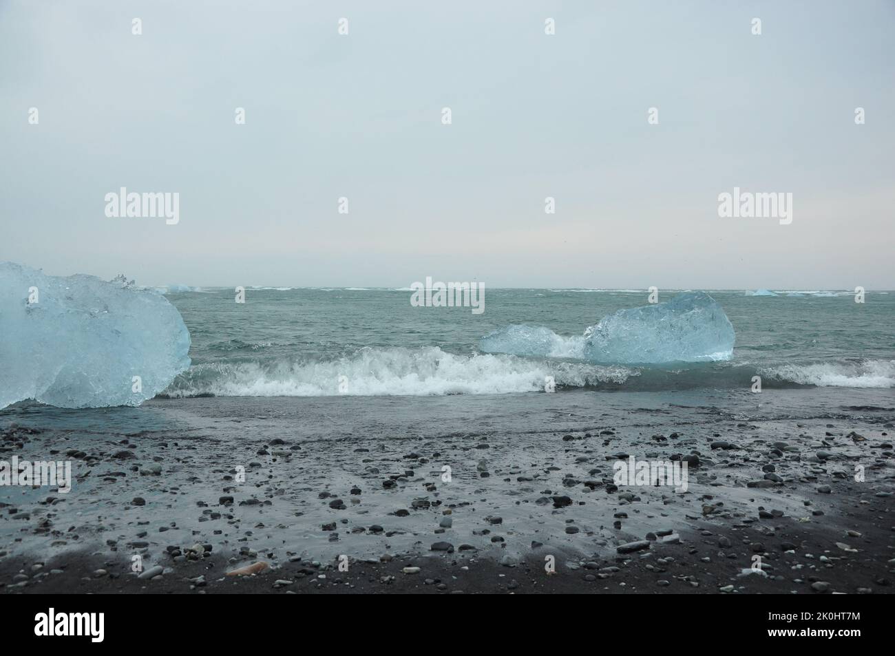The black sand and crystal clear ice chunks at Diamond Beach in ...