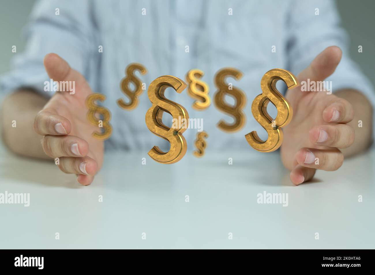 A man presenting the illustrated paragraph signs between his hands ...