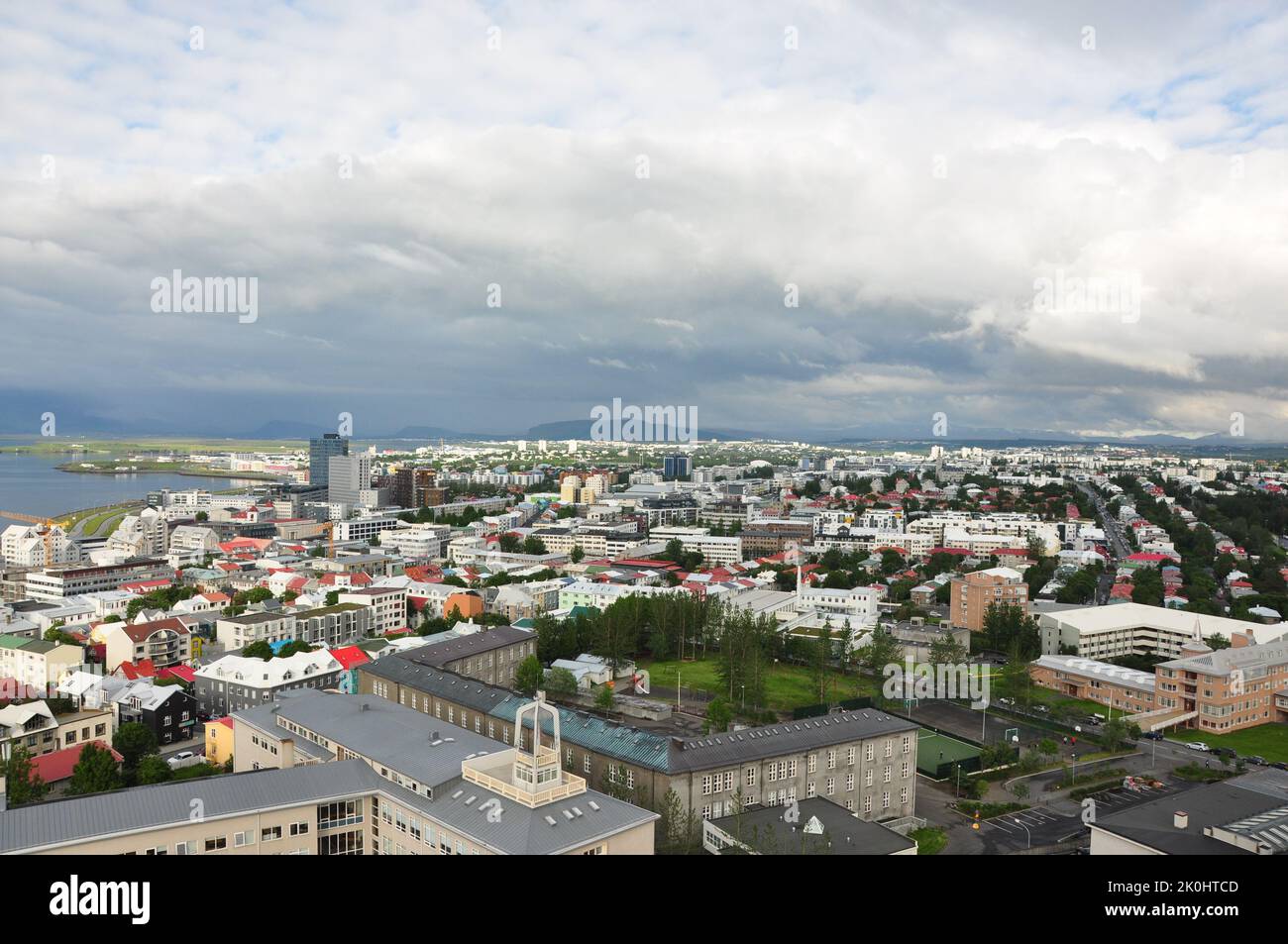 An aerial view of colorful buildings and lush greenery of Reykjavik ...
