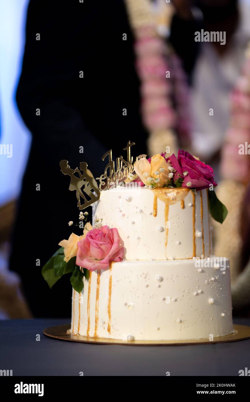 A vertical shot of a beautiful engagement cake Stock Photo - Alamy