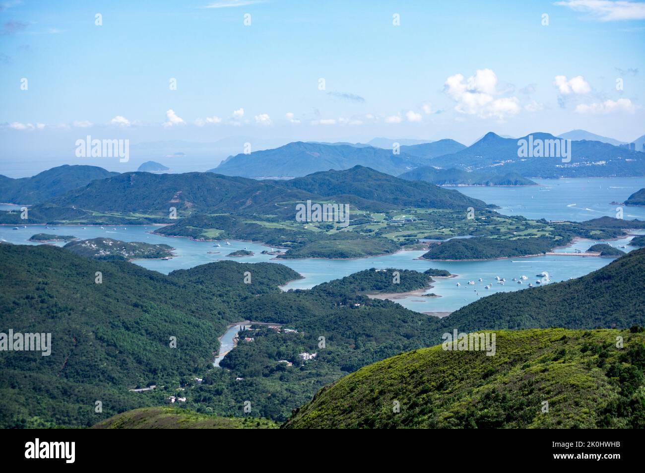 A beautiful greenery landscape, water between hills and cliffs under ...