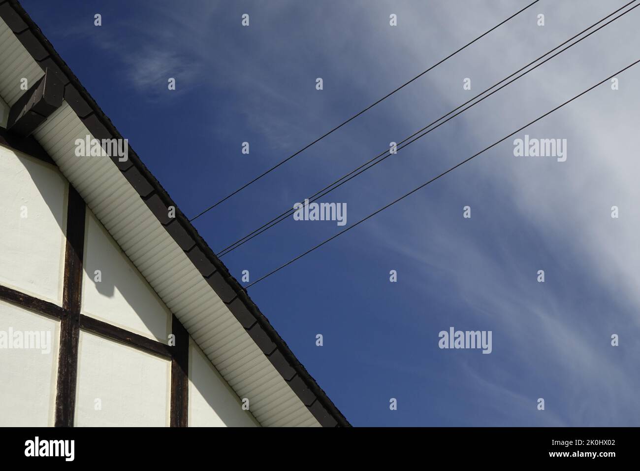 A low angle shot of an old wooden dome of a house against blue sky in ...