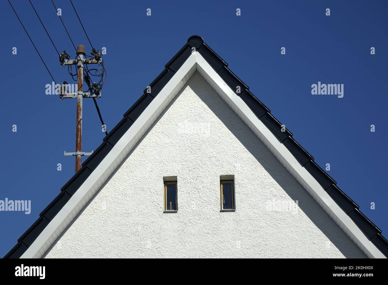 A low angle shot of an old wooden dome of a house against blue sky in ...