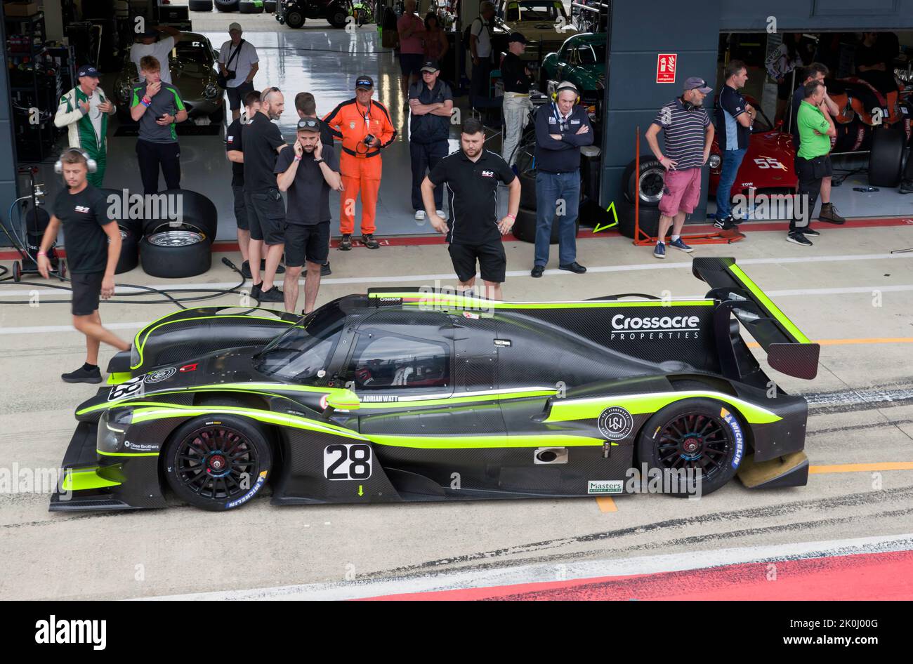 Side view of Adrian Watt's Grey, 2018, Duquine D08, in front of the ...