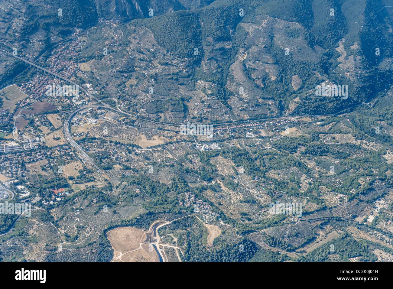 aerial shot, from a small plane, of san Carlo village and Highway ...
