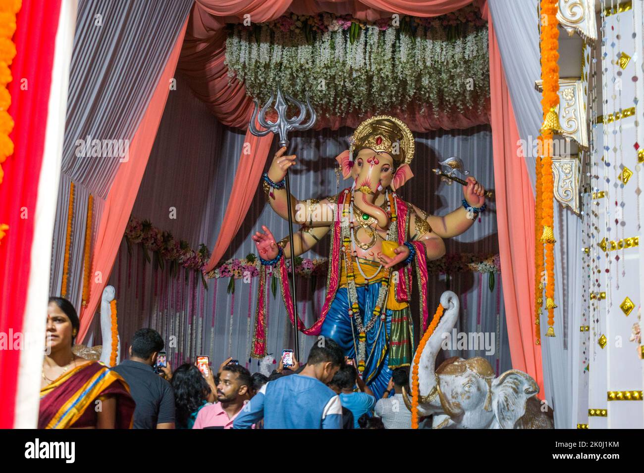A statue of Lord Ganesha at a mandal in Mumbai for the auspicious ...