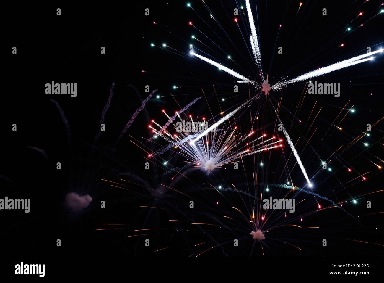 The night sky full of glowing firework sparks Stock Photo - Alamy