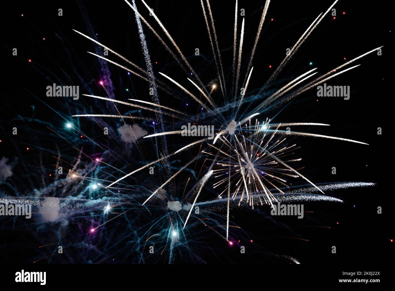 The falling of firework sparks after bursting Stock Photo - Alamy