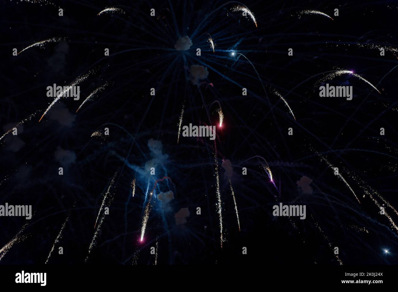 The falling of firework sparks after bursting in the night sky Stock ...