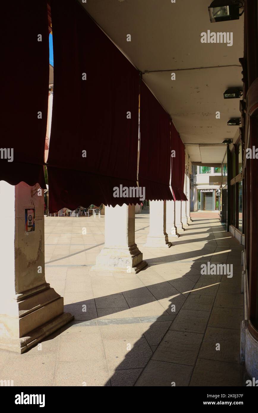 Large blinds providing shade for shop fronts in the Plaza Mayor Burgos ...