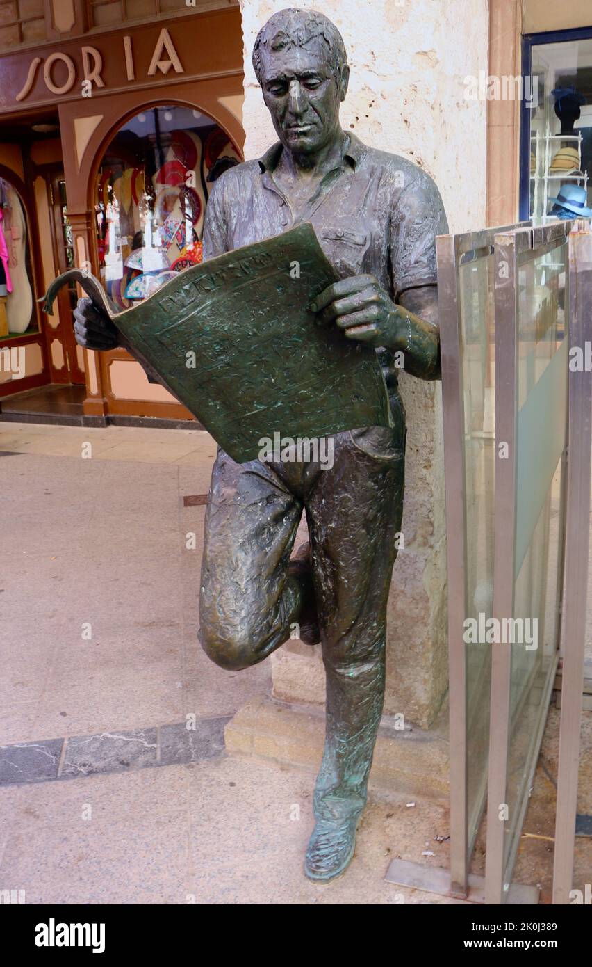 The reader bronze life size statue of a man reading a newspaper El ...