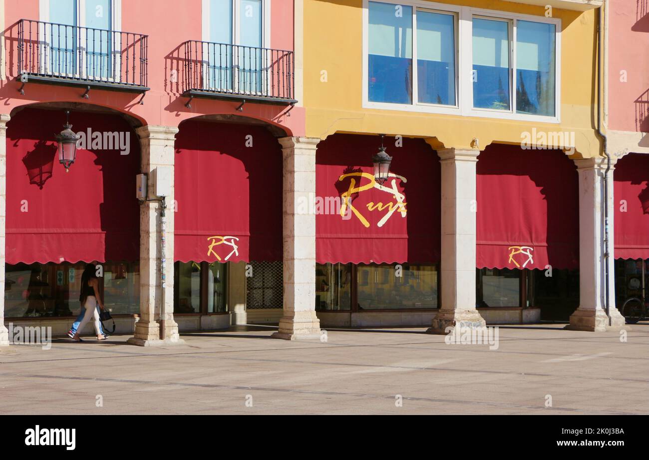 Large blinds providing shade for shop fronts in the Plaza Mayor Burgos ...