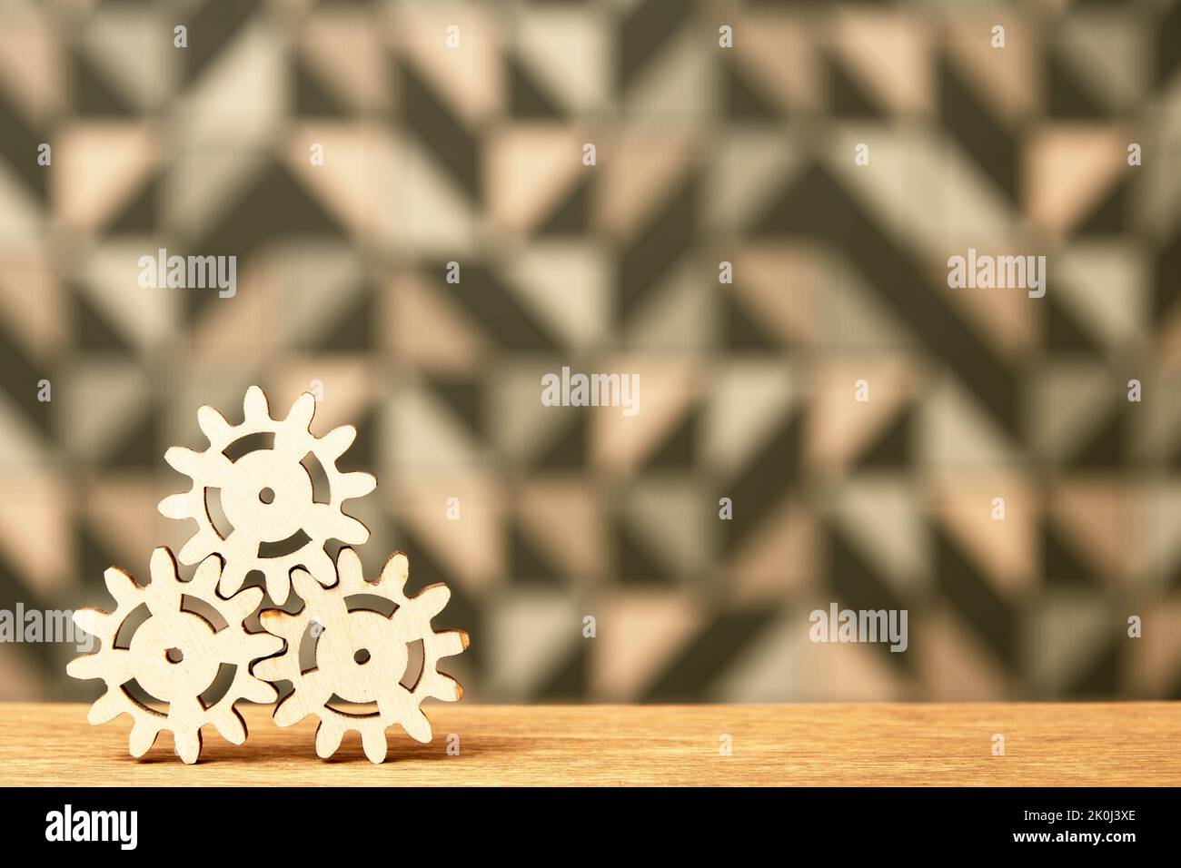 Symbol of puzzle and engineer games with wooden gears and cogs on the ...