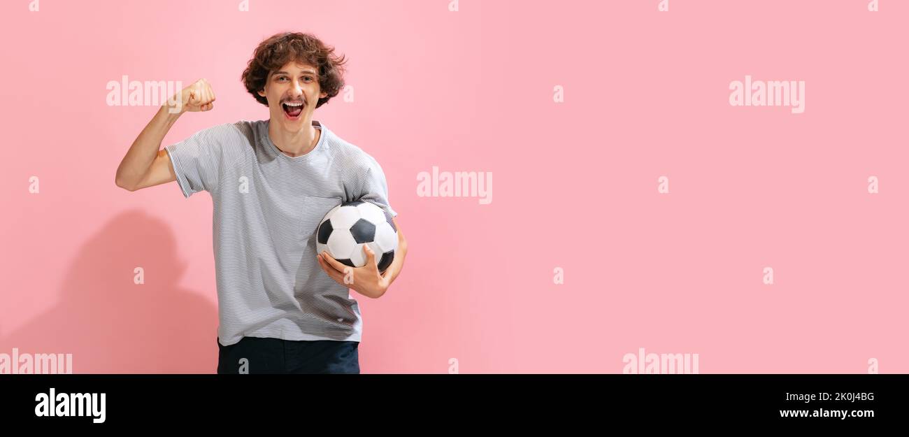 Portrait of young man with mustache, football fan celebrating ...
