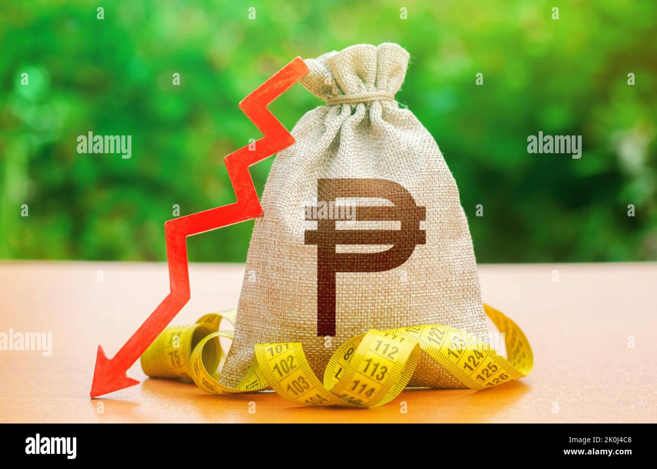 Philippine peso money bag with down arrow and measure tape. Capital ...